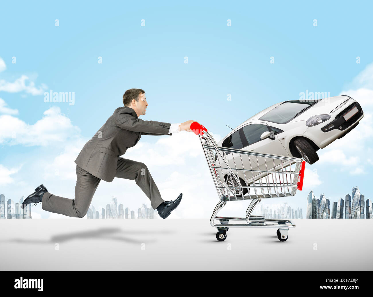 Running businessman with car in shopping cart Stock Photo - Alamy