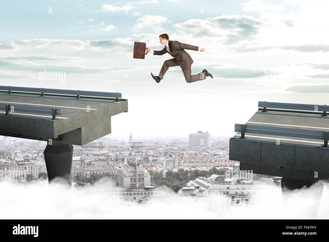 Image of young businessman jumping over gap Stock Photo - Alamy