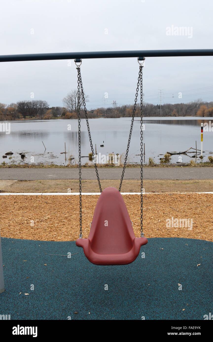Red swing set hi-res stock photography and images - Alamy