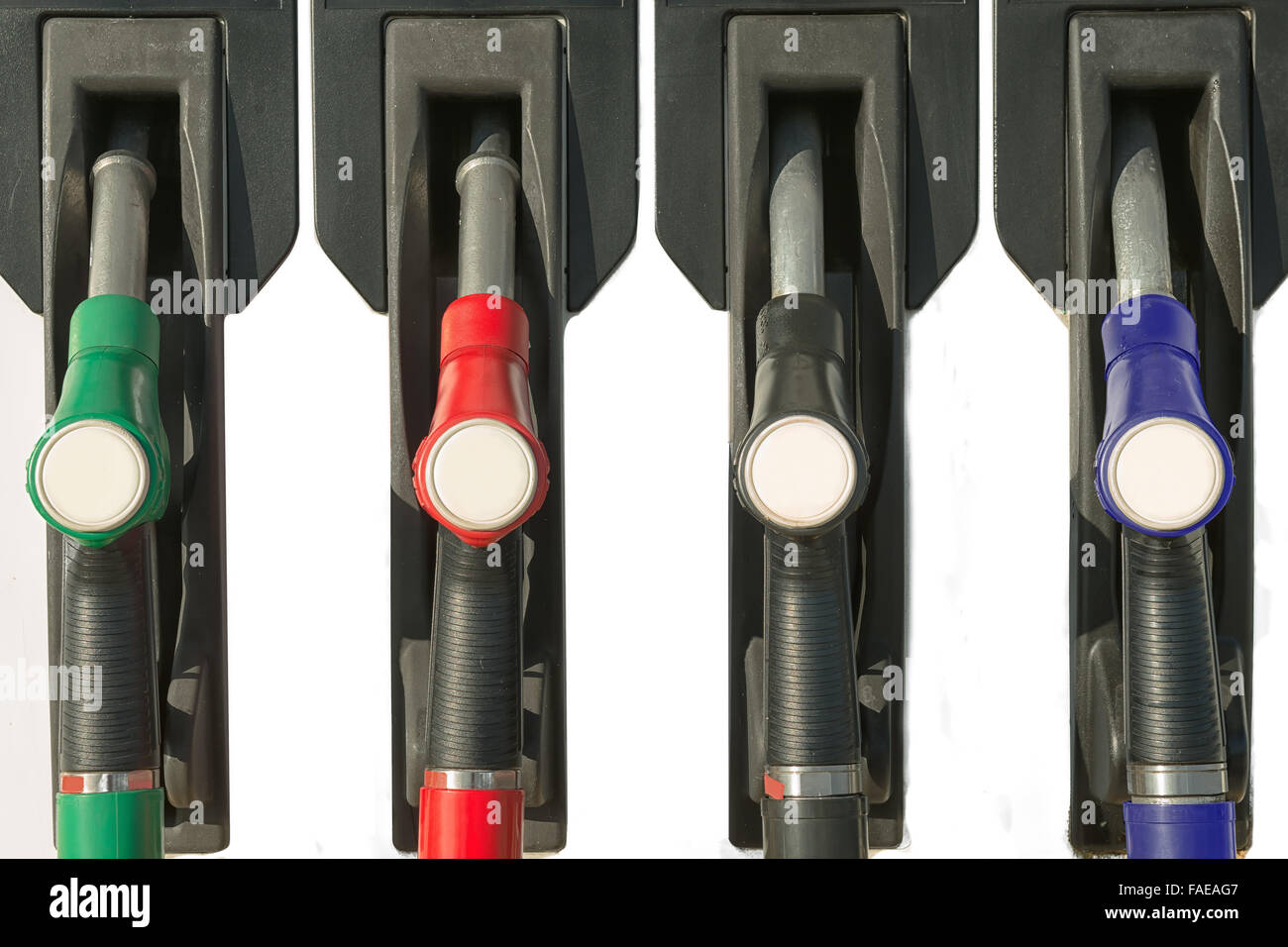 front view of four red green and black gas pump Stock Photo - Alamy