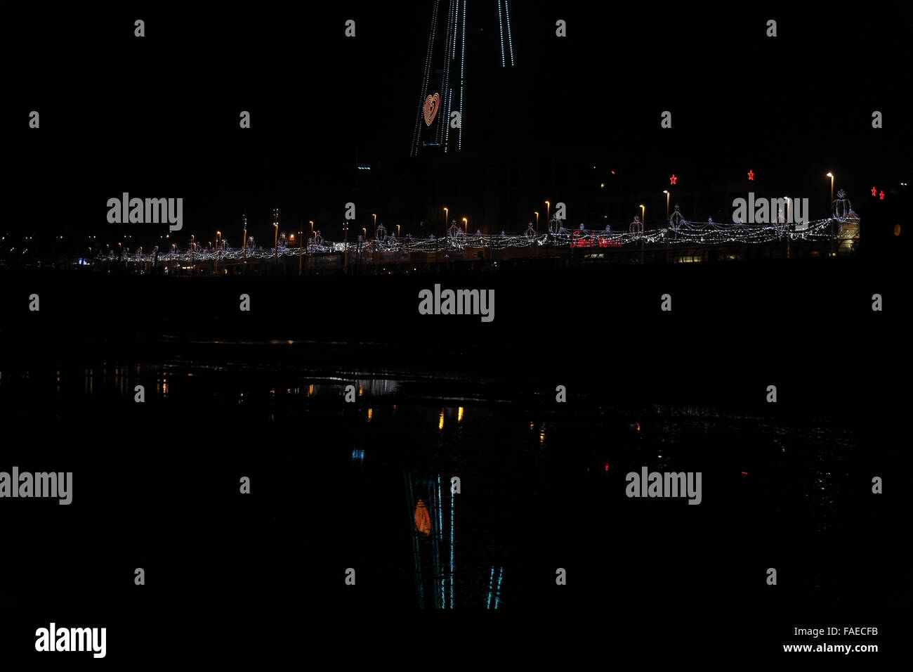 Night oblique beach view, with reflections, to Bling Illuminations and ...