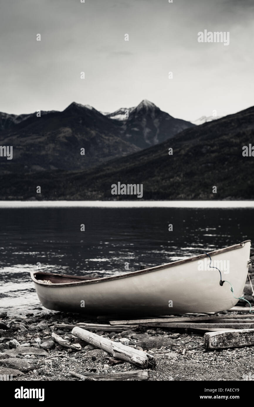 a canoe sits besides the lake at Kaslo British Columbia, in the ...