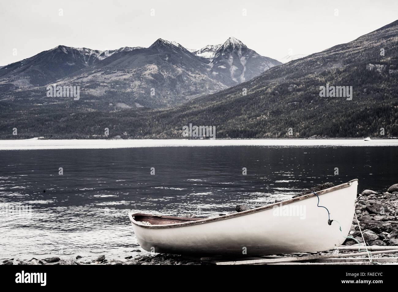 a canoe sits besides the lake at Kaslo British Columbia, in the ...