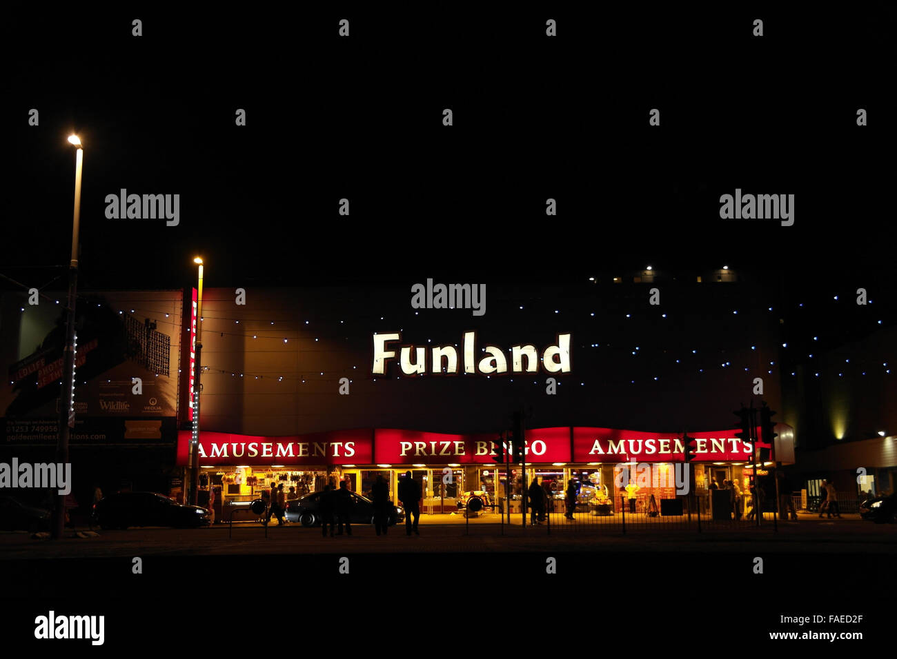 Night view across Central Promenade towards illuminated doorway ...