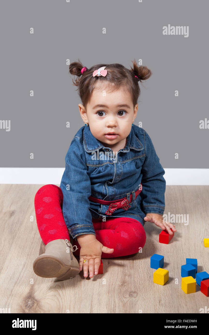 Portrait of 1 and a half gorgeous baby girl indoor Stock Photo - Alamy