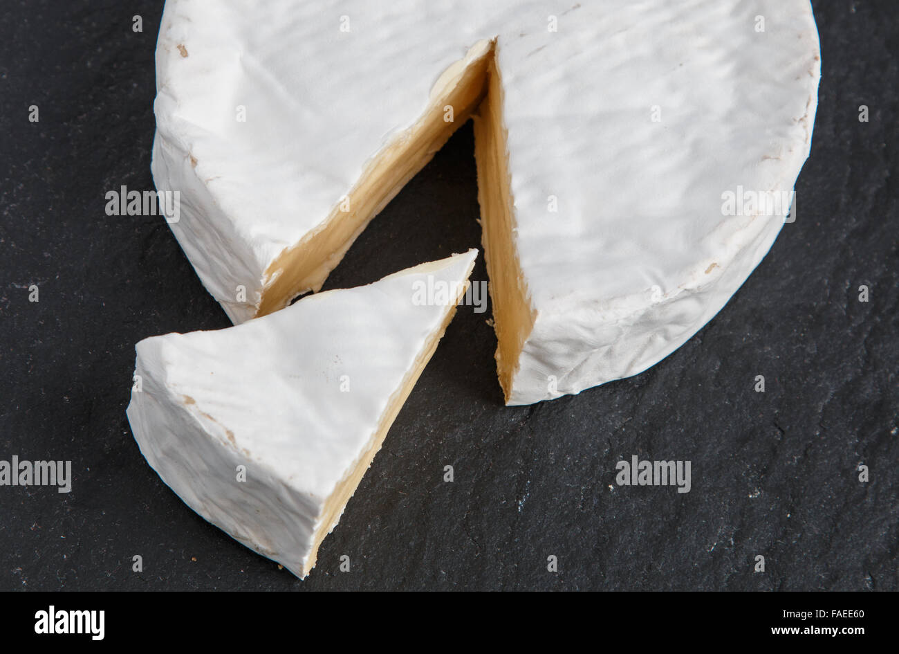 Brie Segment of cut from a whole English Brie cheese Stock Photo - Alamy