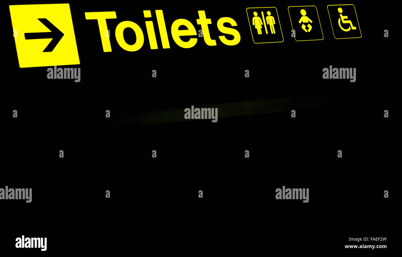 Airport information sign light panel giving directions to toilets in ...