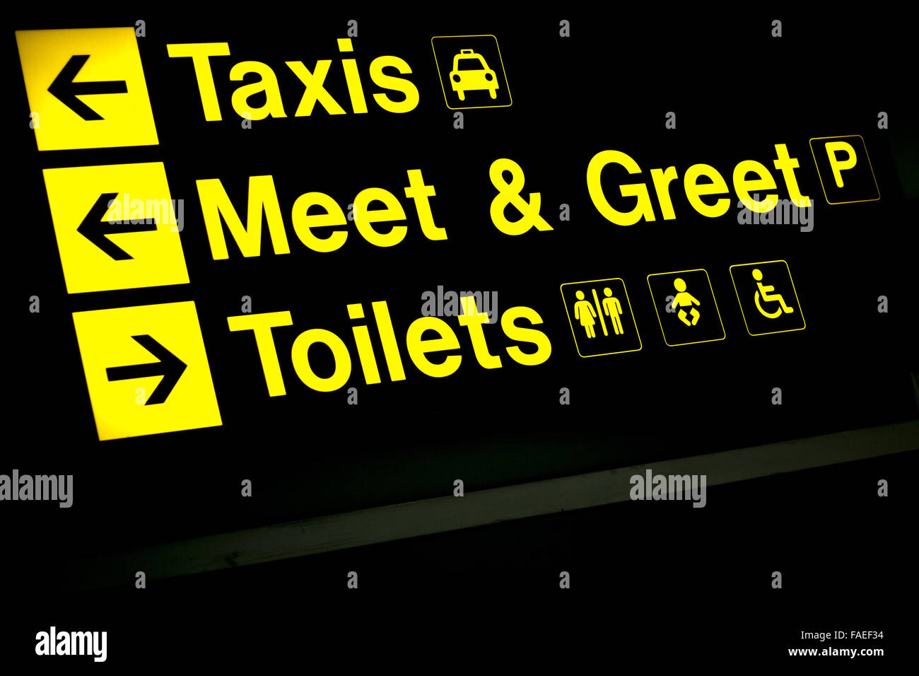 Airport information sign light panel giving directions in arrivals ...