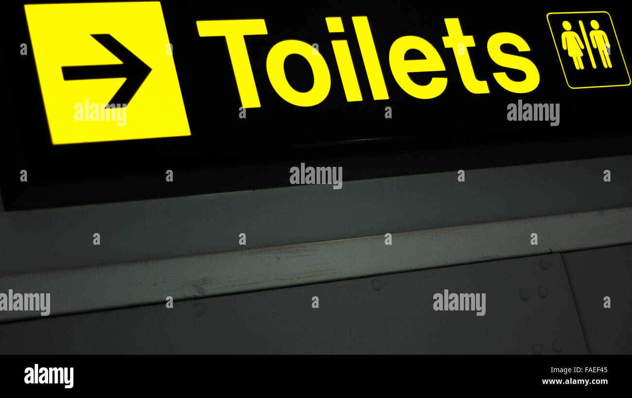 Airport information sign light panel giving directions to toilets in ...