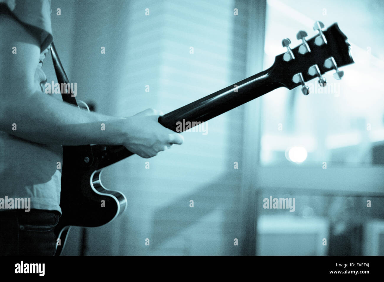 Guitar player musician in recording studio photo Stock Photo - Alamy