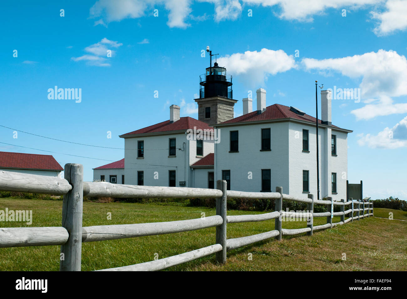 Wooden fence leads to Beavertail lighthouse. It is the third oldest ...