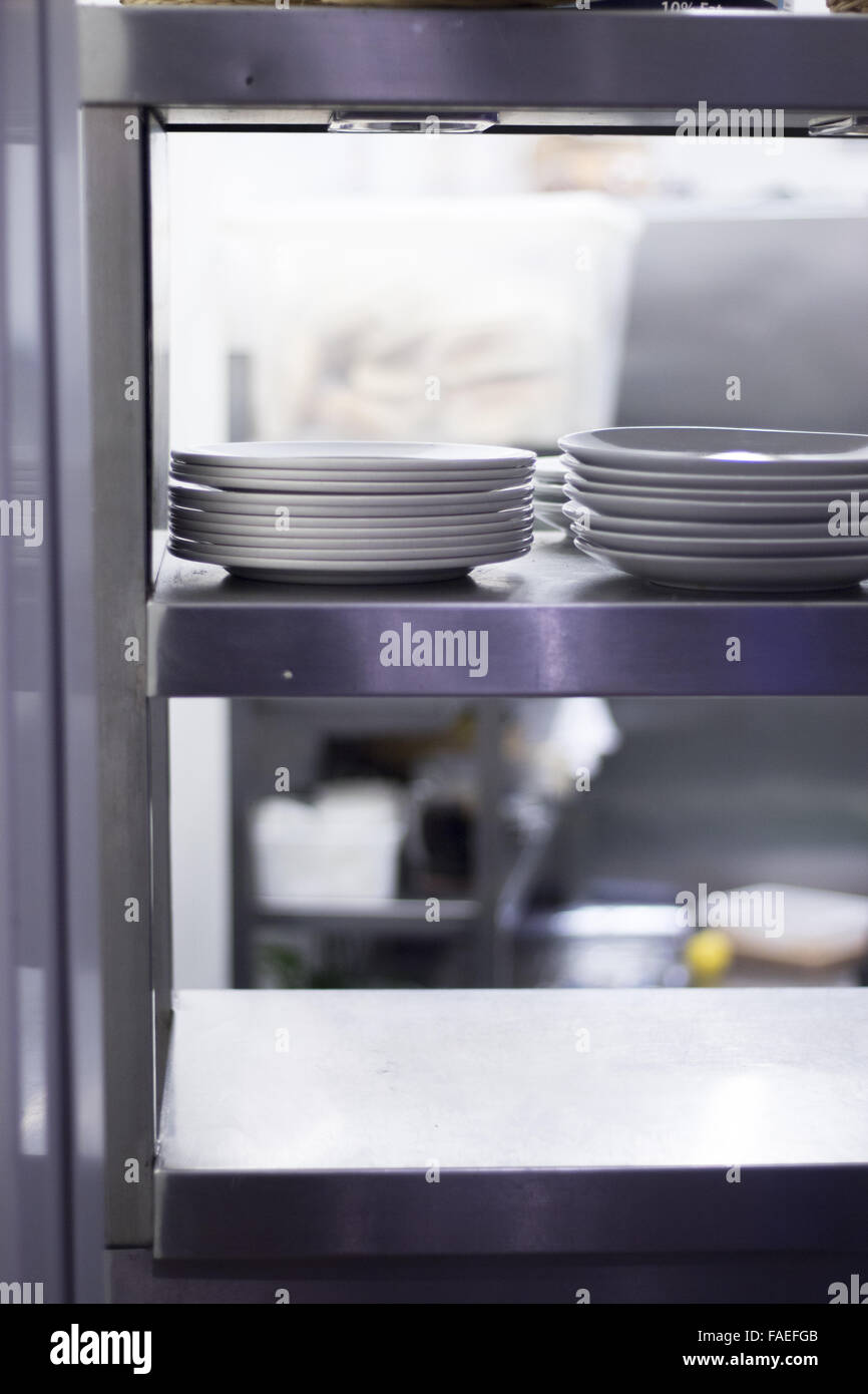 Plates in restaurant cafe kitchen photo Stock Photo - Alamy