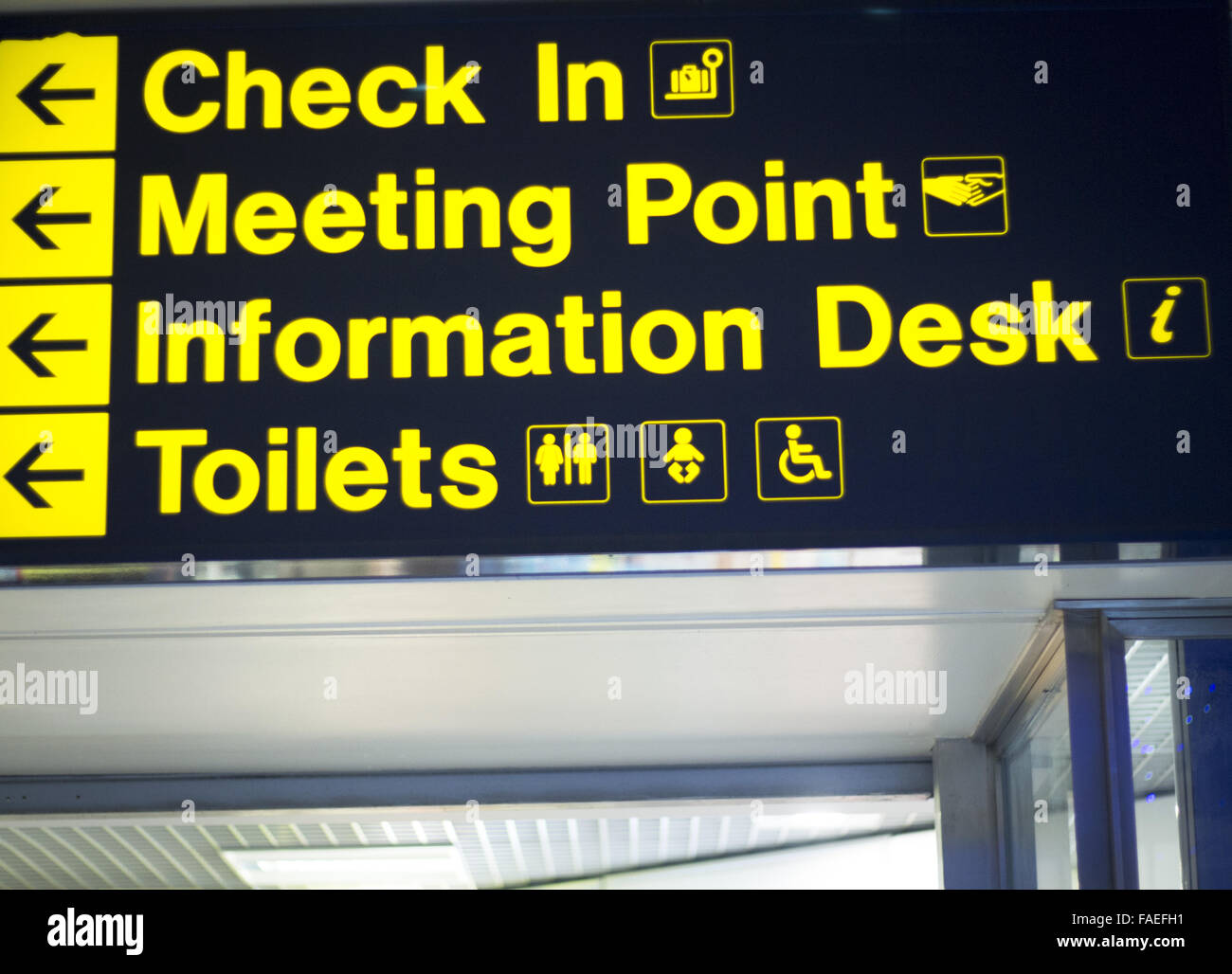Airport information sign light panel giving directions in departure ...