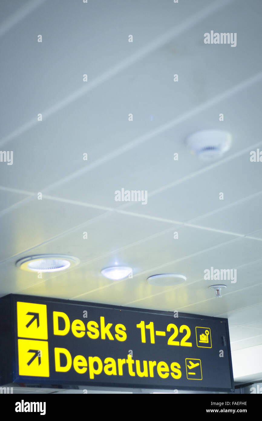Airport desks information sign light panel giving directions in ...