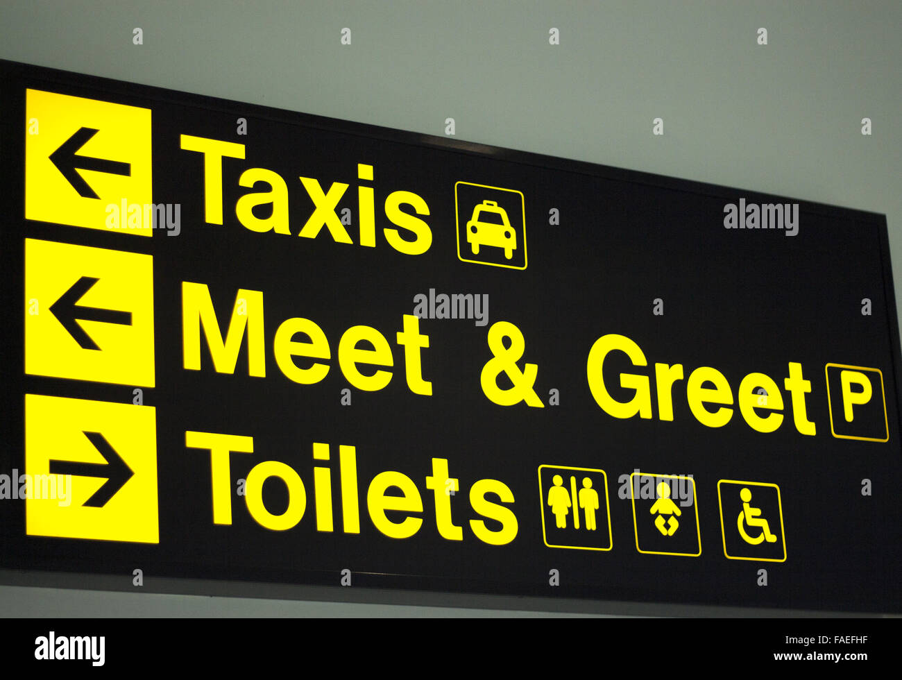 Airport information sign light panel giving directions in arrivals ...