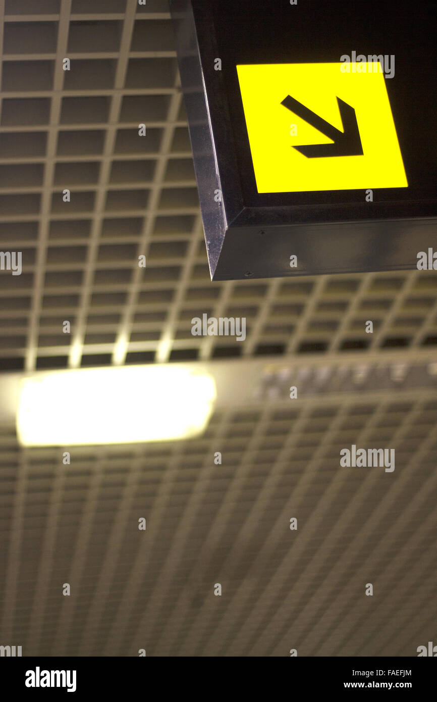 Airport information sign light panel giving directions with arrow in ...