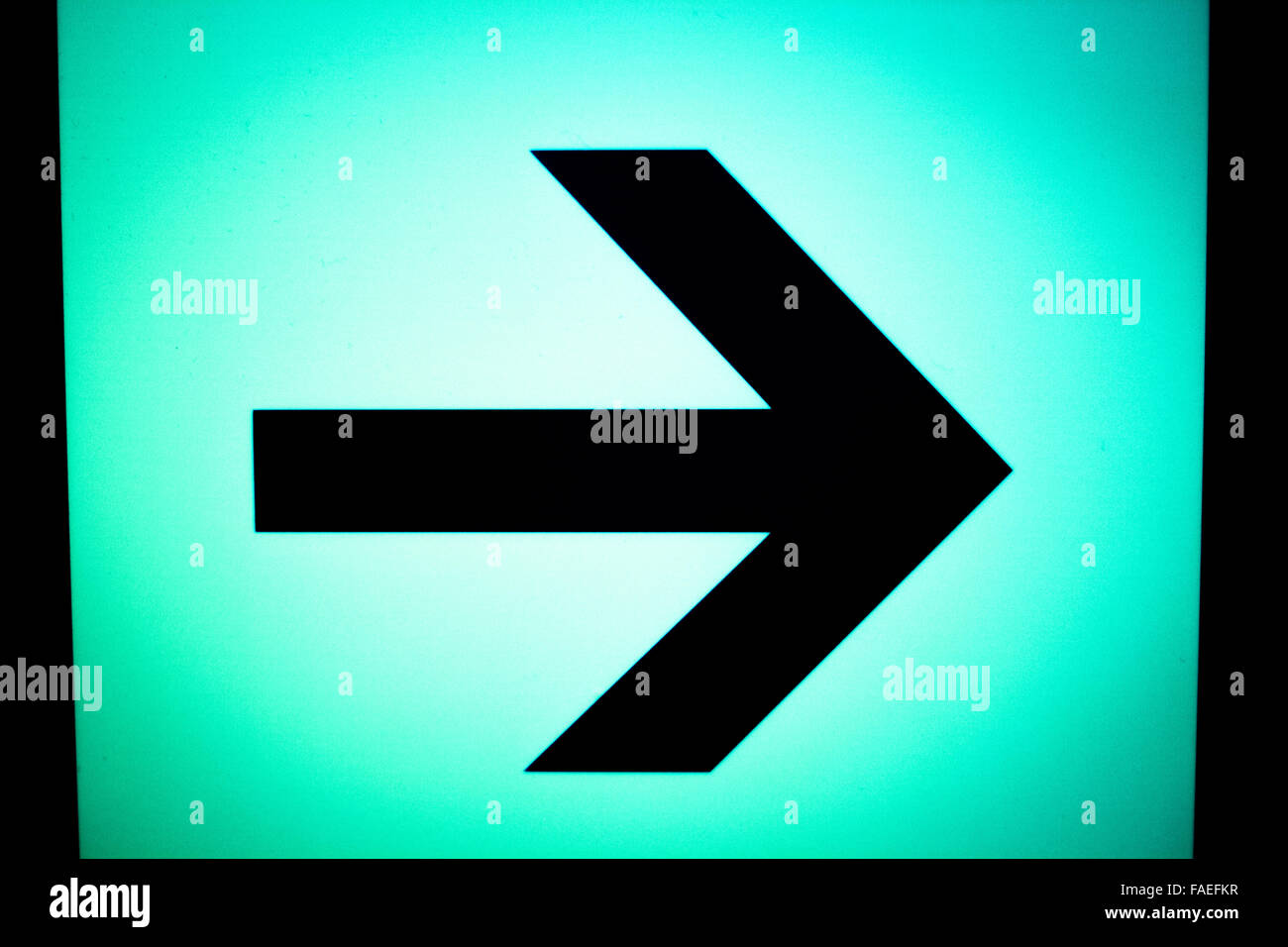 Airport information sign light panel giving directions with arrow in ...