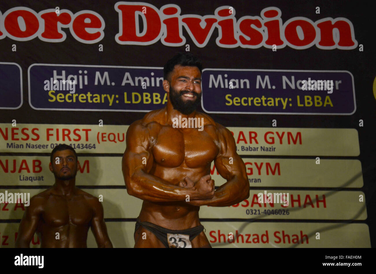 Lahore, Pakistan. 28th Dec, 2015. Pakistani body builders posing during ...
