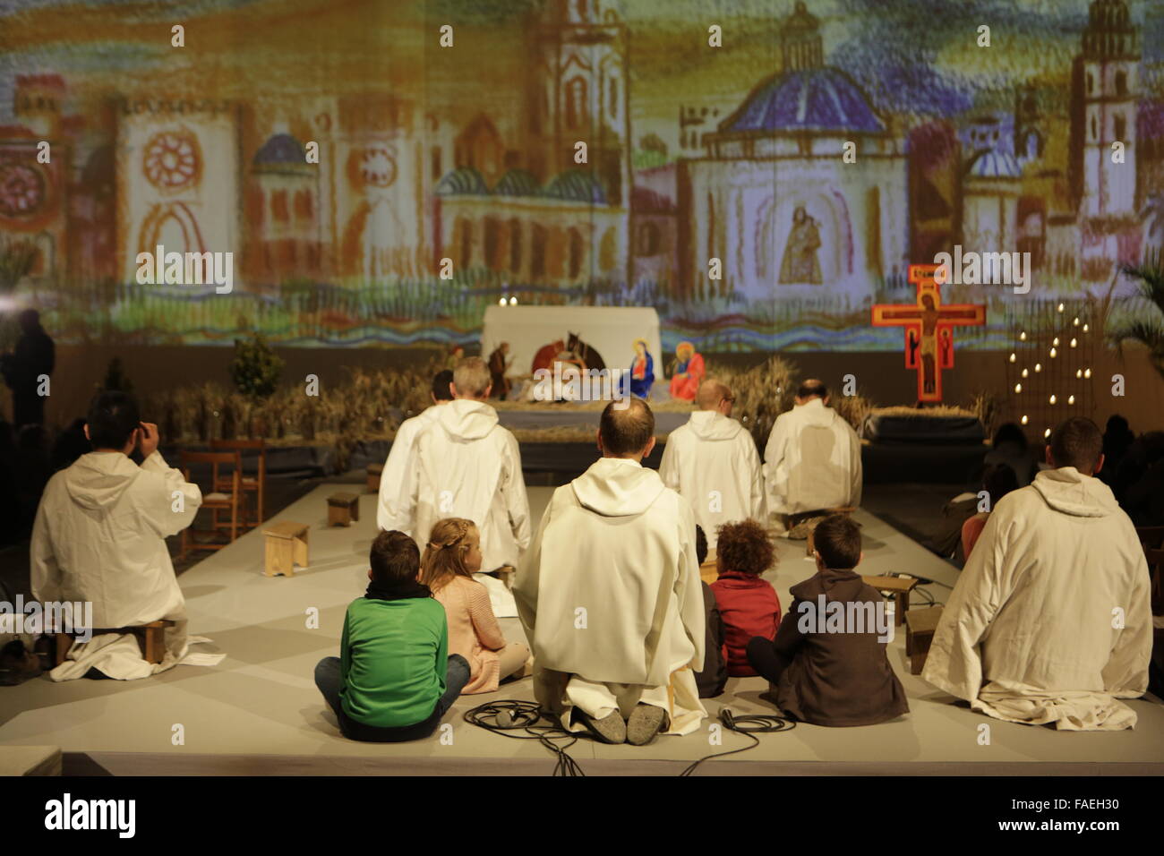 Valencia, Spain. 28th Dec, 2015. The brothers of Taizé sit in front of ...