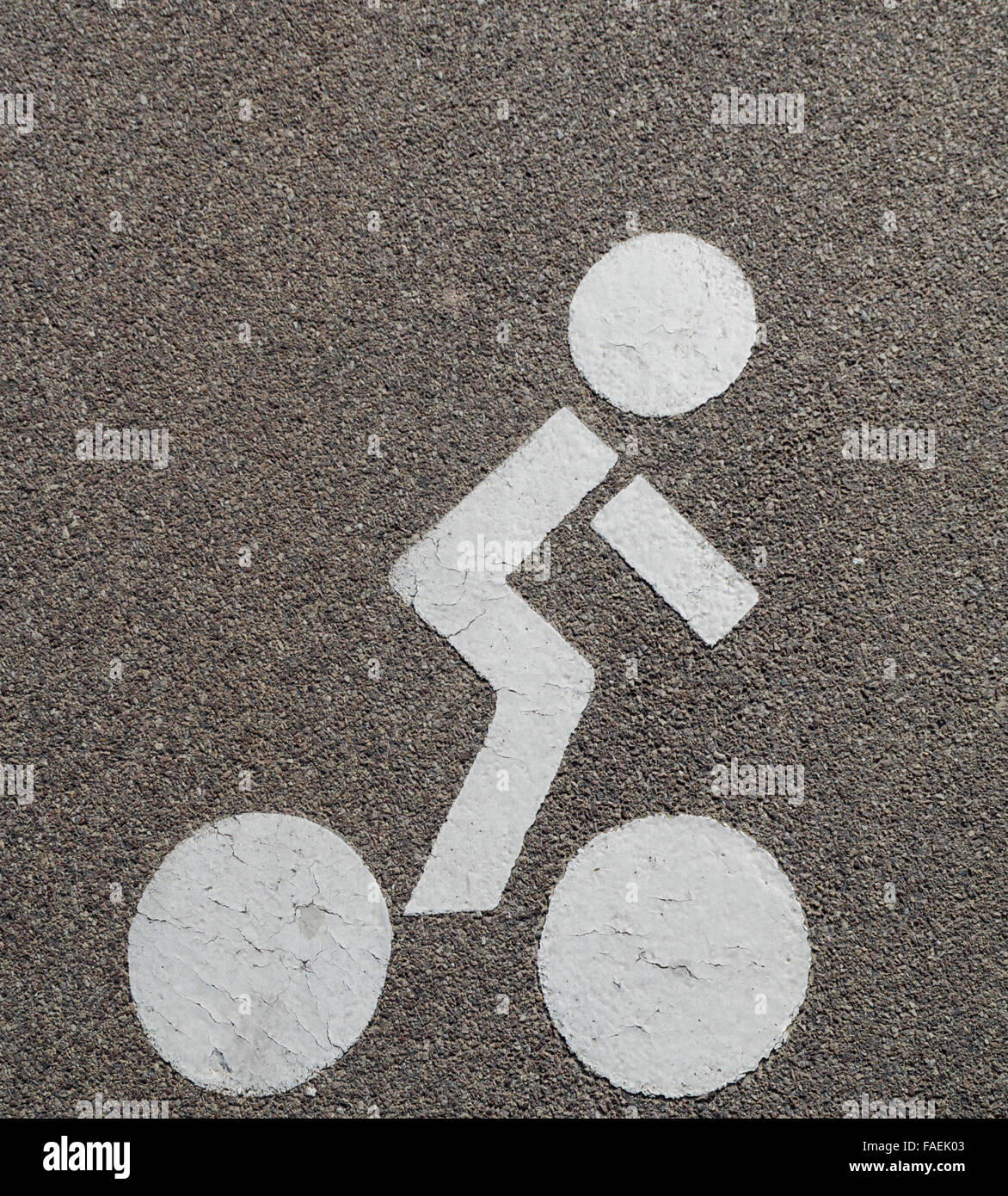 Cyclist icon on a pavement Stock Photo - Alamy