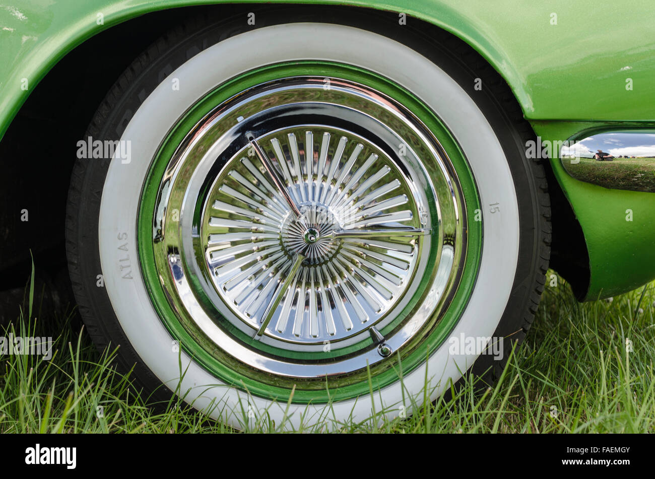 Whitewall tyre on a custom classic car finished in metallic greem with ...