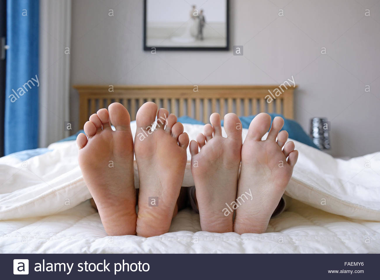 Couple Bed Feet Stock Photos & Couple Bed Feet Stock Images - Alamy