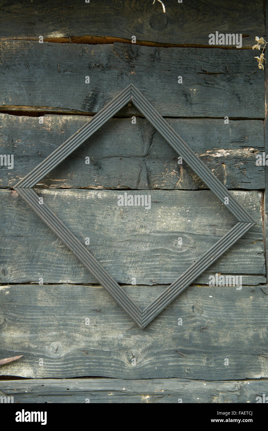 old empty frame on the wall of wood Stock Photo - Alamy