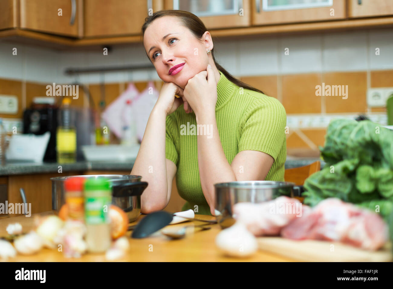 Woman stressed cooking meat hi-res stock photography and images - Alamy