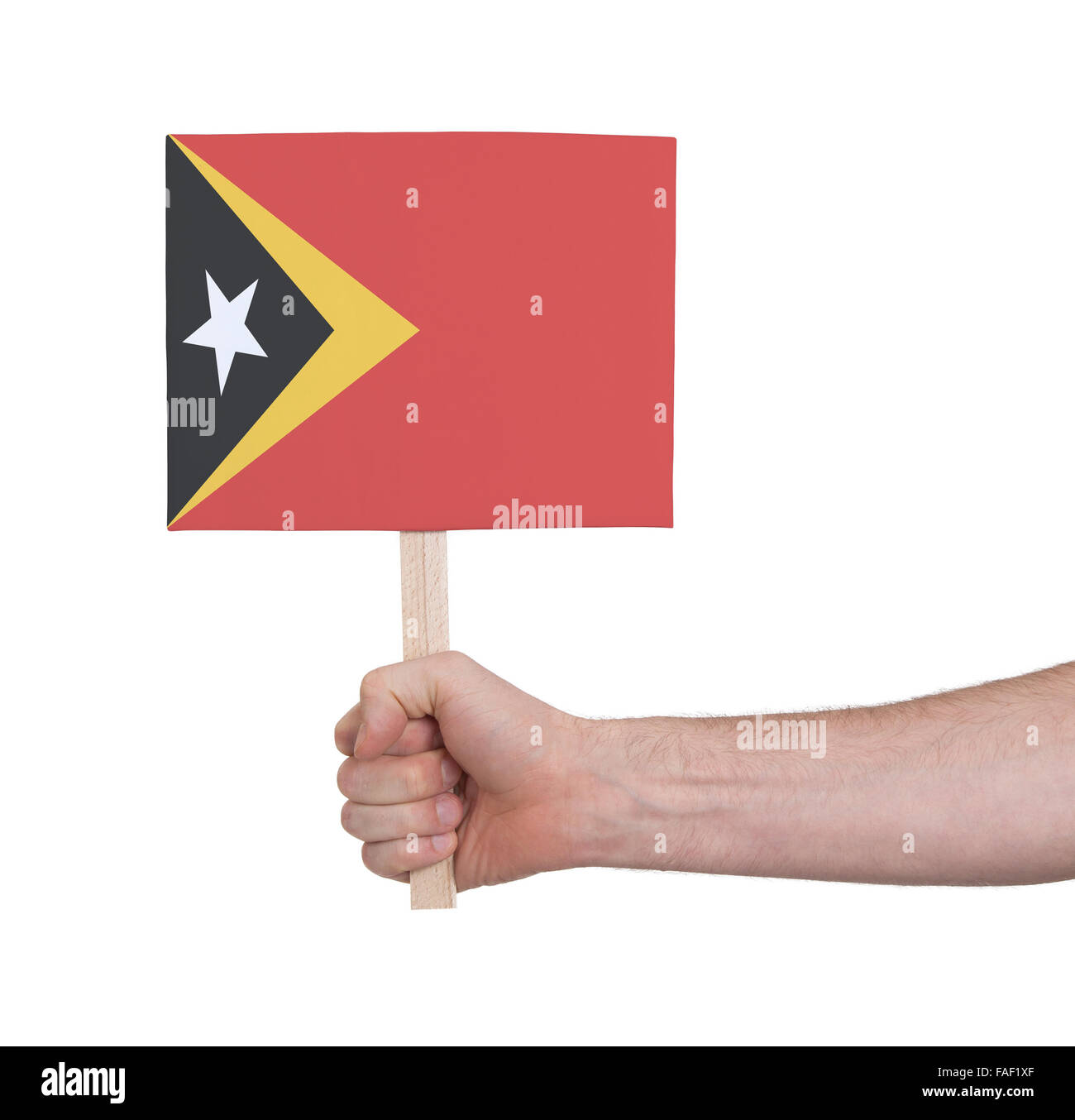 Hand holding small card, isolated on white - Flag of East Timor Stock ...
