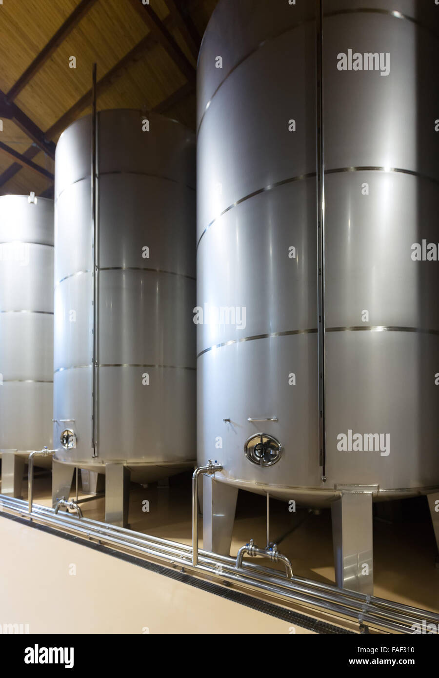 contemporary stell barrels in factory Stock Photo - Alamy