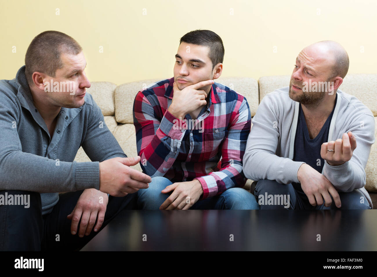 Guys sitting on the hi-res stock photography and images - Alamy