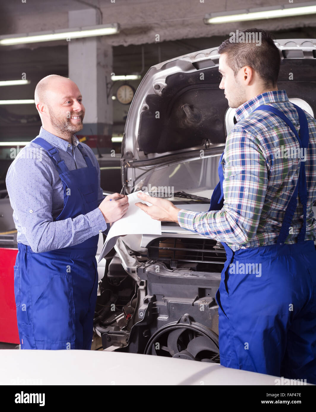 Professional appraisal of damage for repairing car at auto workshop ...