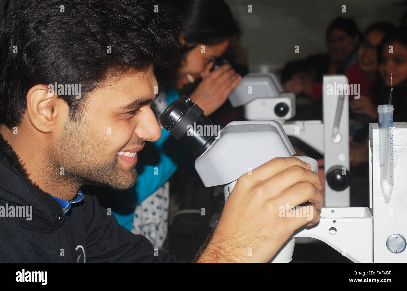 Student working in Biology Lab with Microscope Stock Photo - Alamy