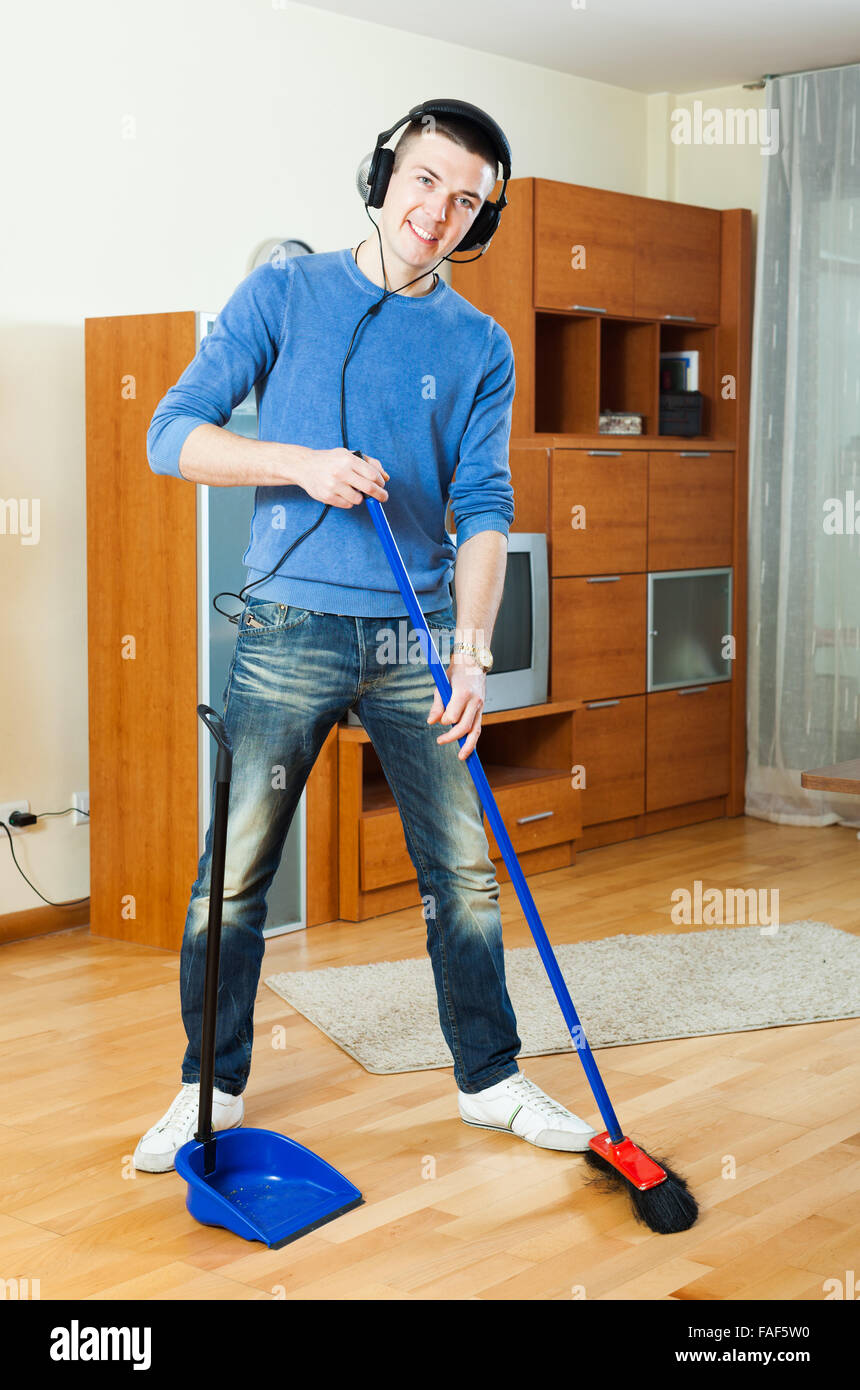 Man sweeping floor dustpan broom High Resolution Stock Photography and ...