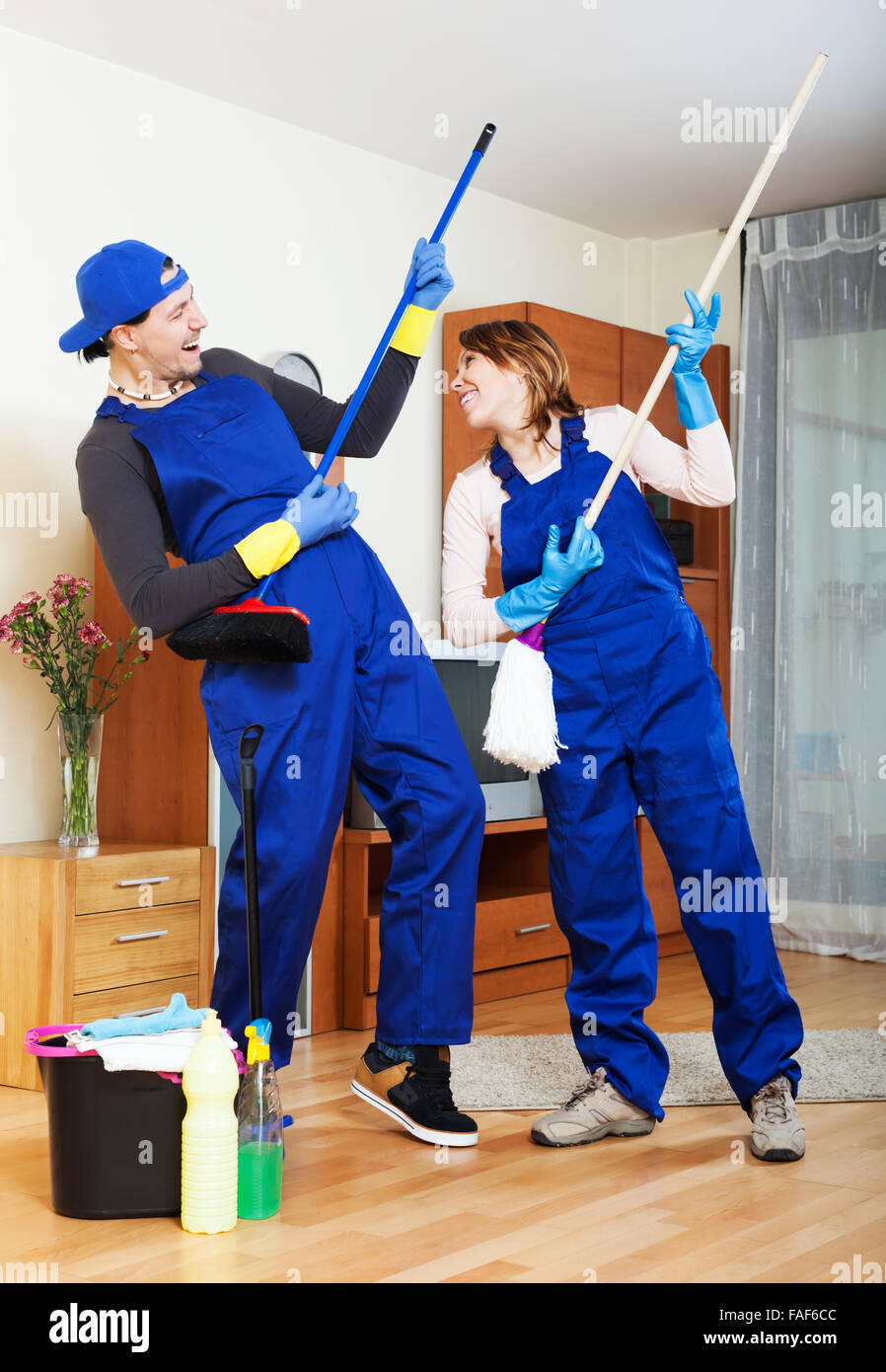 Smiling cleaning team in uniform is ready to work Stock Photo - Alamy