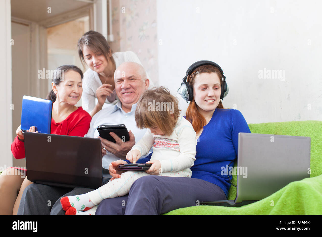 people uses portable computers at home Stock Photo - Alamy
