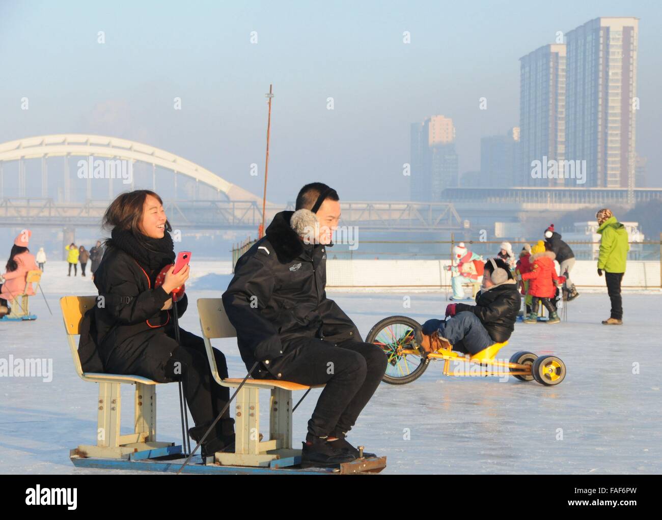 Harbin, China's Heilongjiang Province. 29th Dec, 2015. Residents sleigh ...