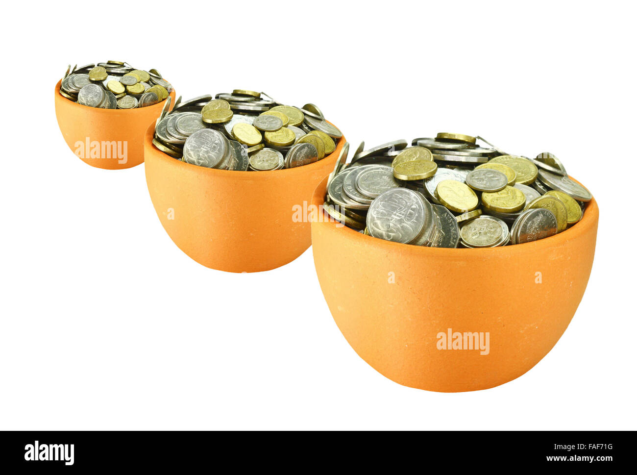 three ceramic pots with coins on white background Stock Photo - Alamy