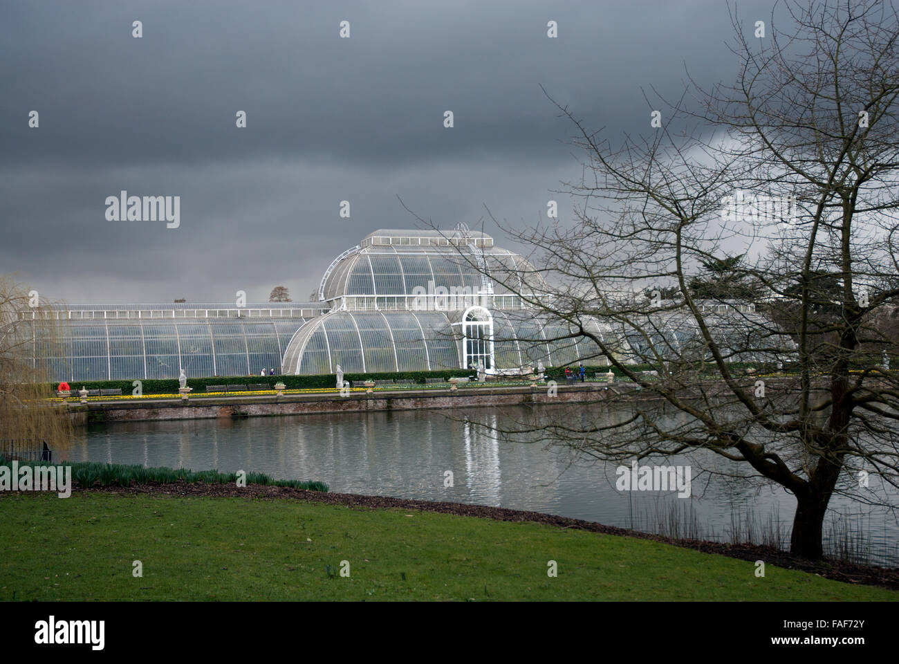 The Victorian Palm House and lake, Kew Gardens, London UK Stock Photo ...