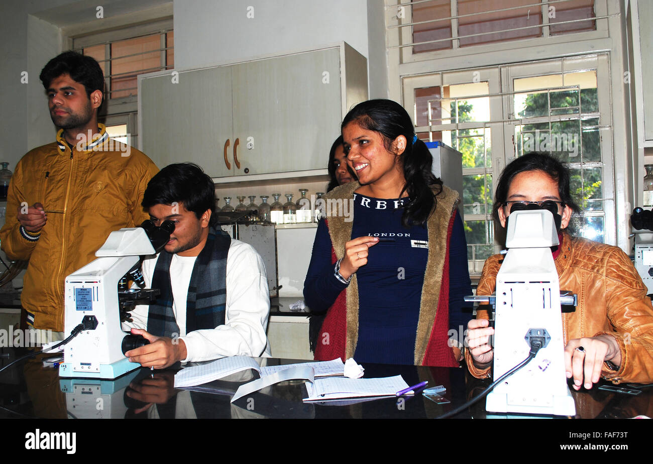 Student working in Biology Lab with Microscope Stock Photo - Alamy