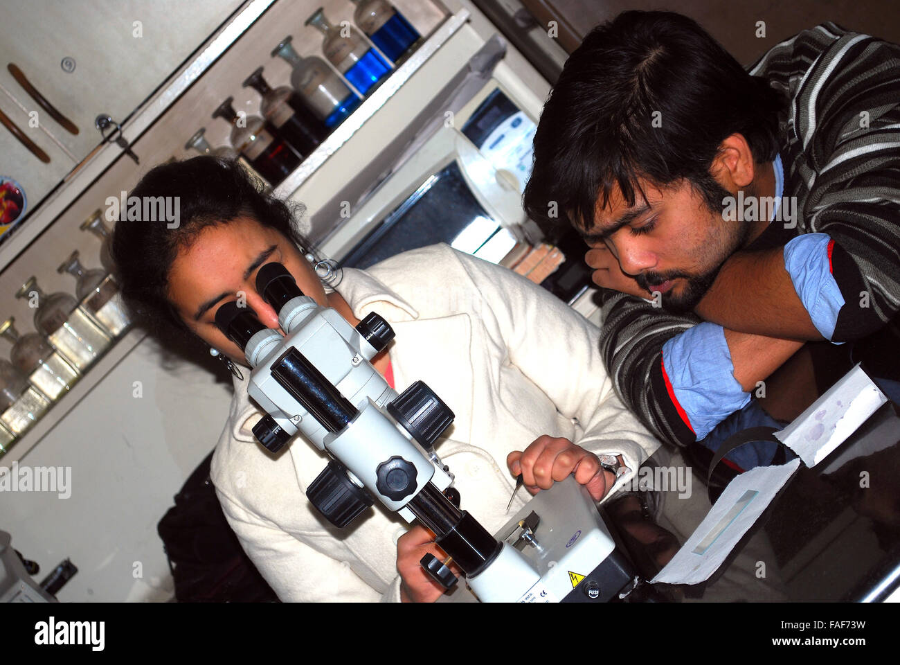 Student working in Biology Lab with Microscope Stock Photo - Alamy