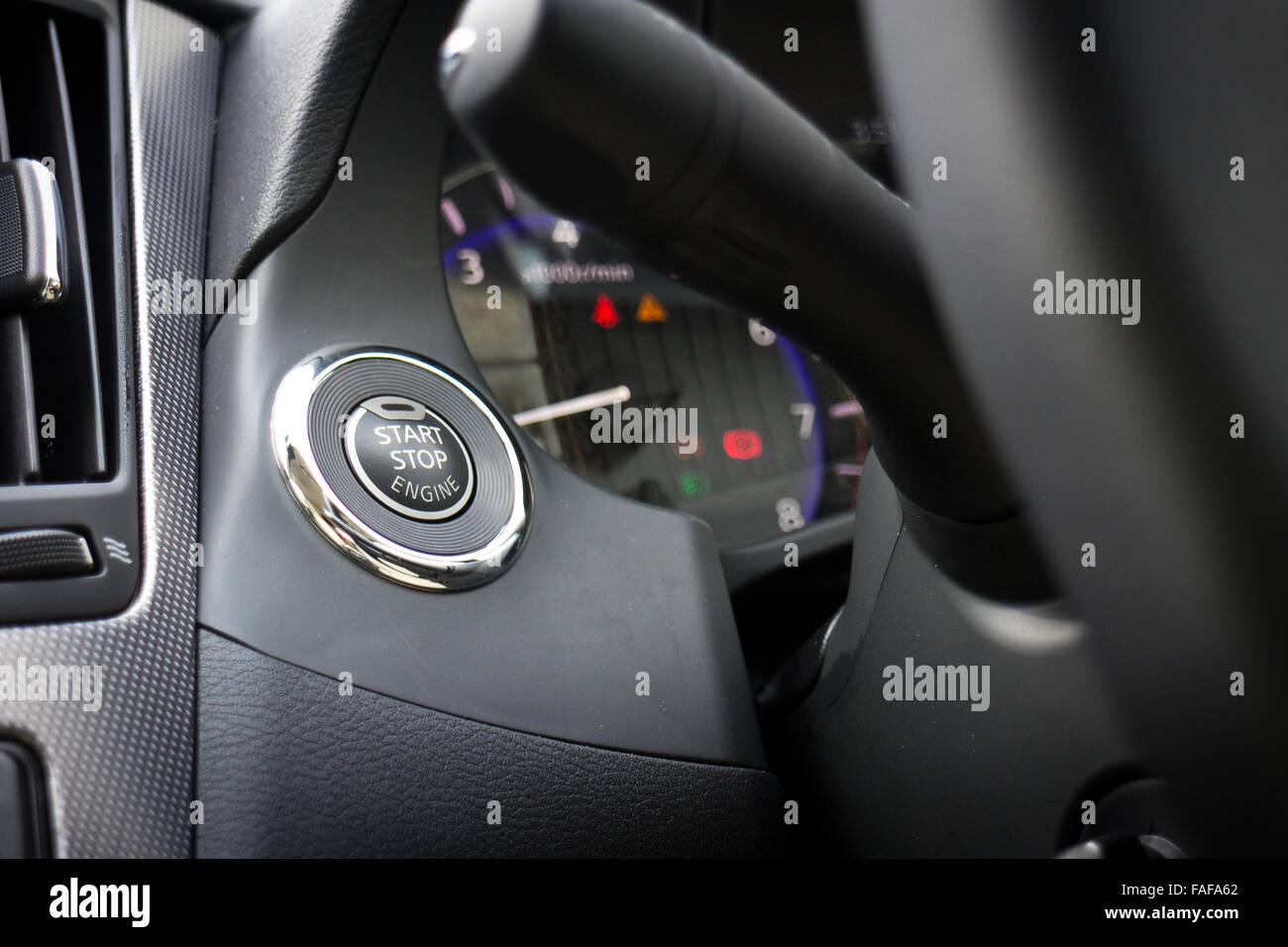 Start Stop Engine button in Sedan Car Stock Photo - Alamy