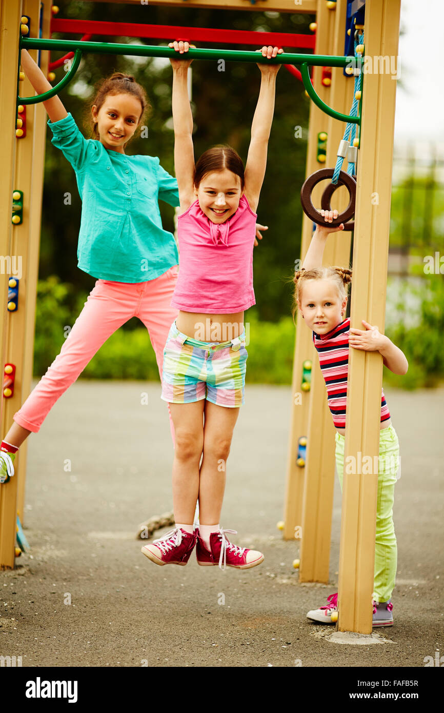 Kids playing on playground equipment hi-res stock photography and ...
