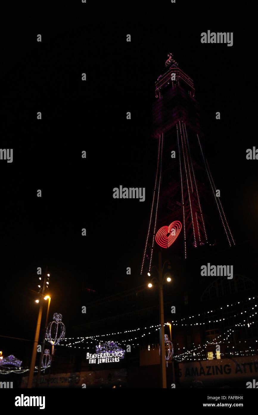 Night oblique portrait purple lights Blackpool Tower, with red heart ...