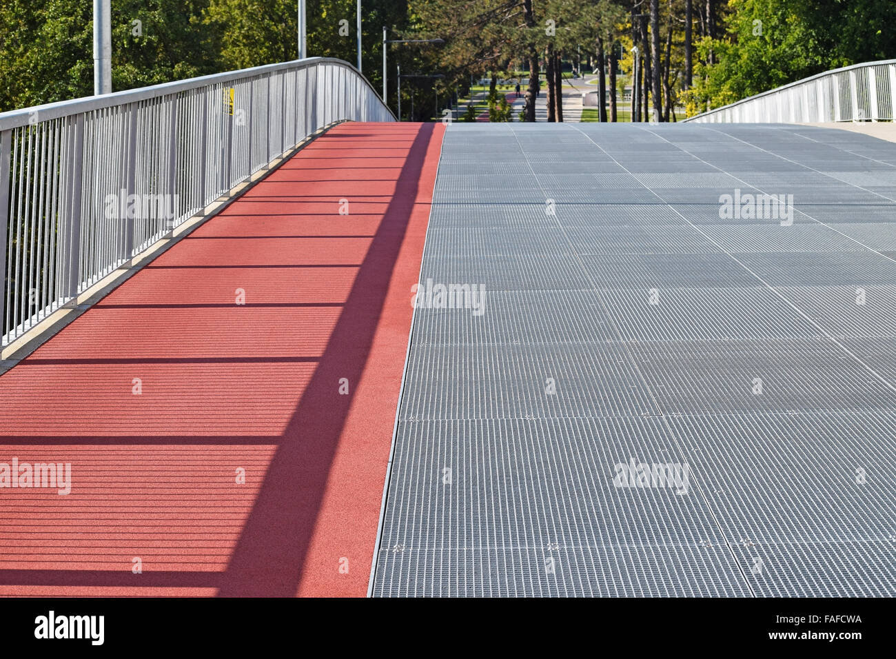 Running track on the pedestrian bridge next to a stadium Stock Photo ...