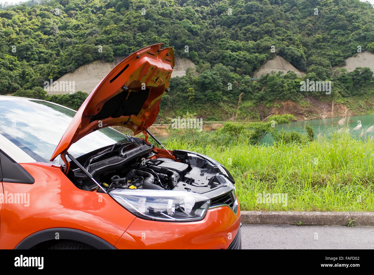 Car with open front hood Stock Photo - Alamy