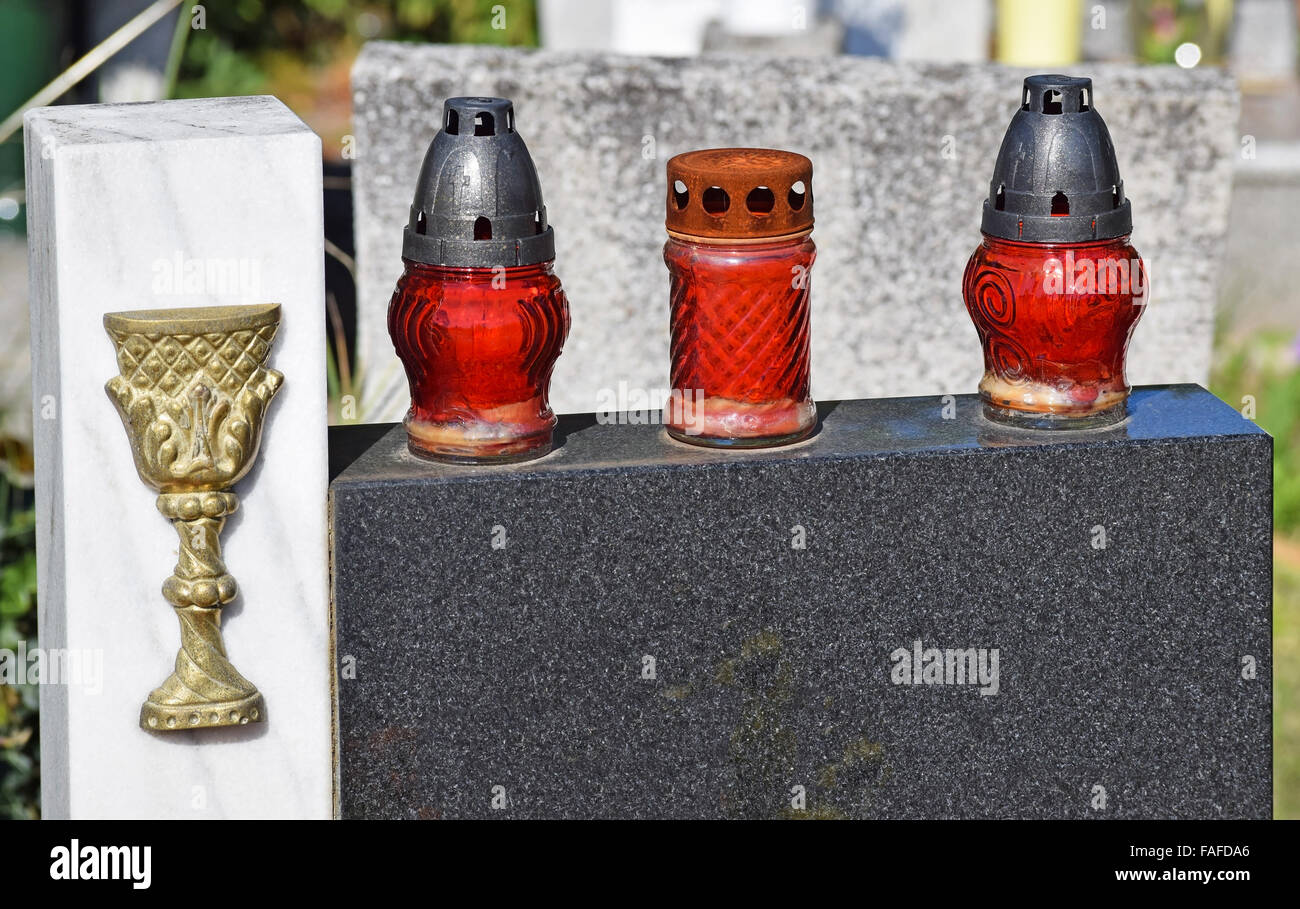 Lantern on the tombstone in the public cemetery Stock Photo - Alamy