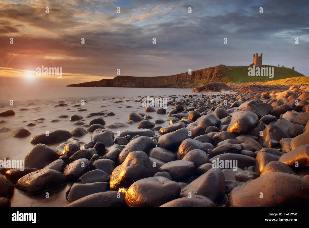 Dunstanburgh castle beach hi-res stock photography and images - Alamy