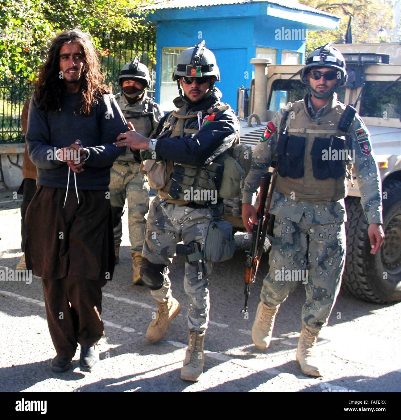 Nangarhar, Afghanistan. 29th Dec, 2015. Afghan police officers walk ...