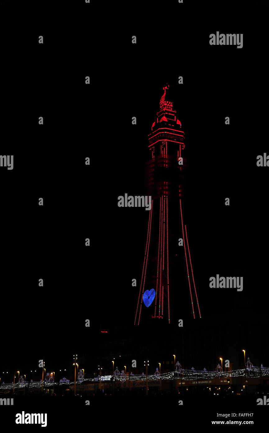 Night portrait red Blackpool Tower with blue heart sculpture above ...